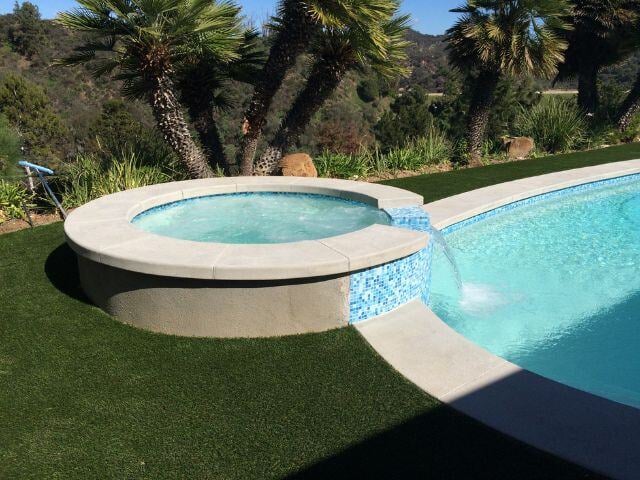 Guide to Pool Hardscape Options: Grass, Concrete, Pavers & More!